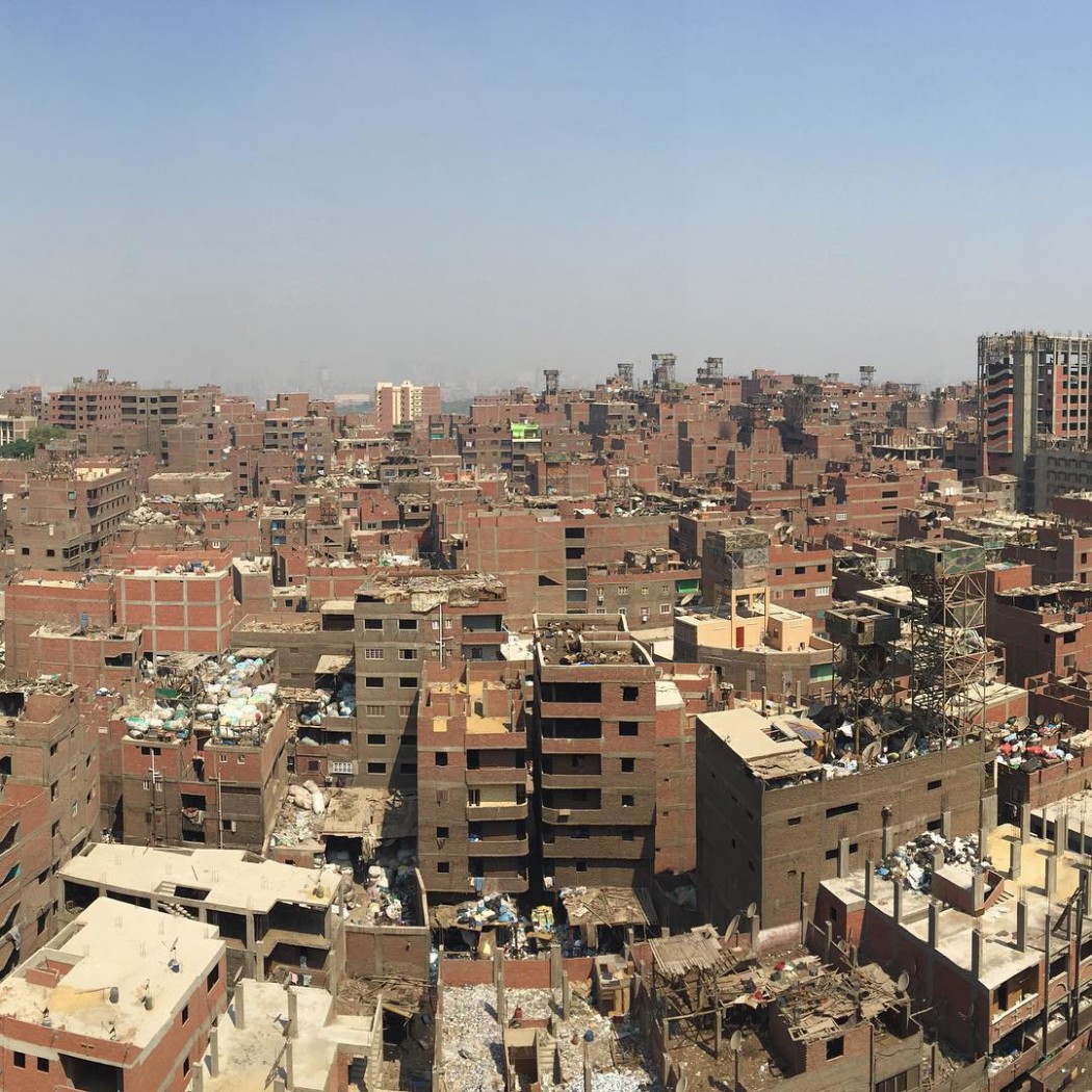 Street artist eL Seed paints a mural across 50 Cairo buildings - The Spaces